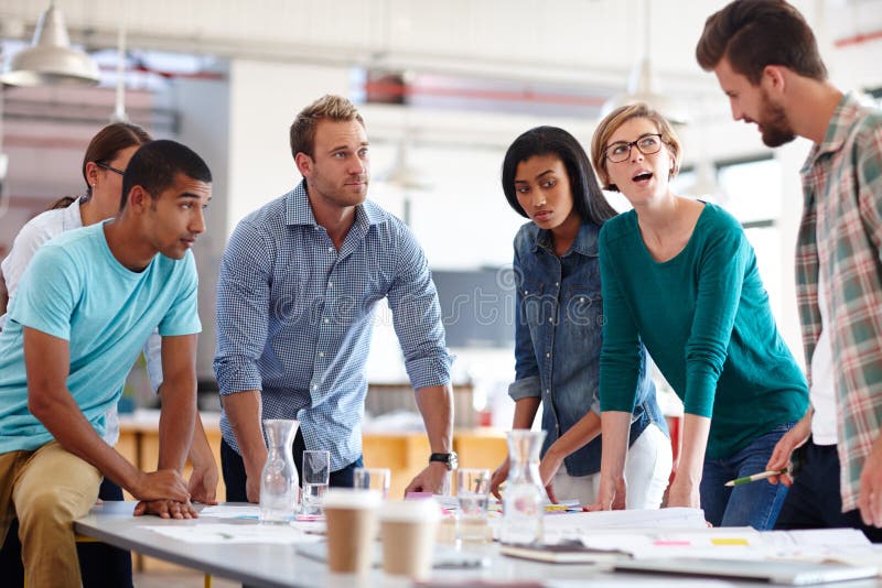 Teamwork Makes the Dream Work. Shot of a Group of Young Designers ...