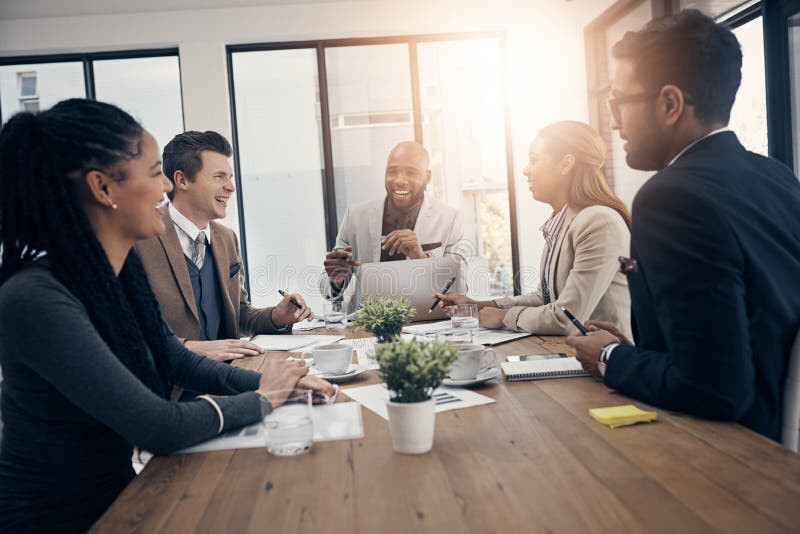 Teamwork is a Meeting Essential. a Group of Young Businesspeople Having ...