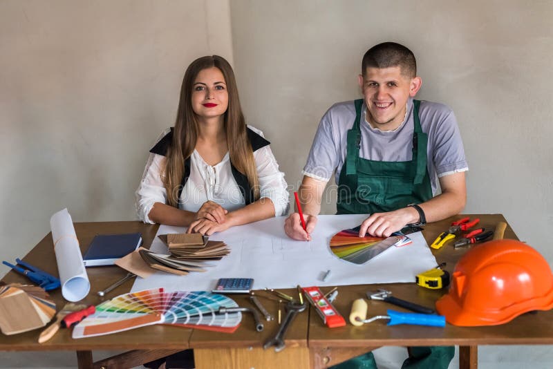 Teamwork on New Project, Woman - Designer and Man - Builder Stock Image ...