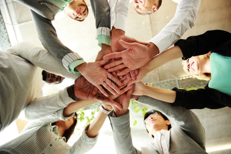 Teamwork in an Office with Hands Together Stock Image - Image of ...