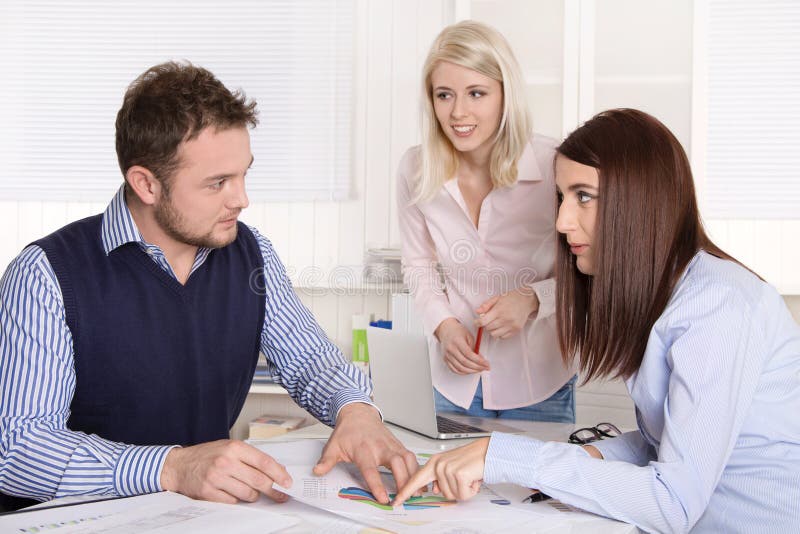 Teamwork between Three Business People at Desk at Office. Stock Image ...