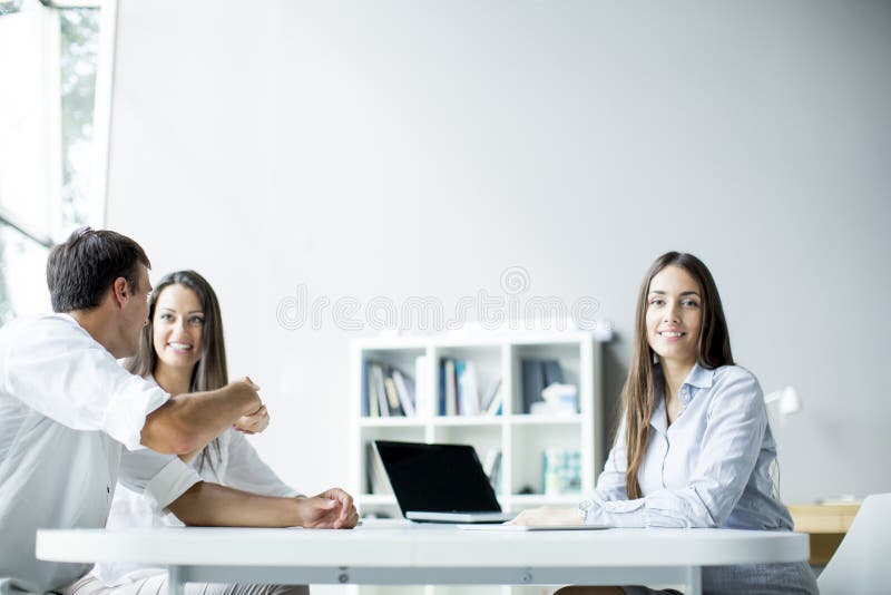 Teamwork in the office stock image. Image of businesspeople - 64929671