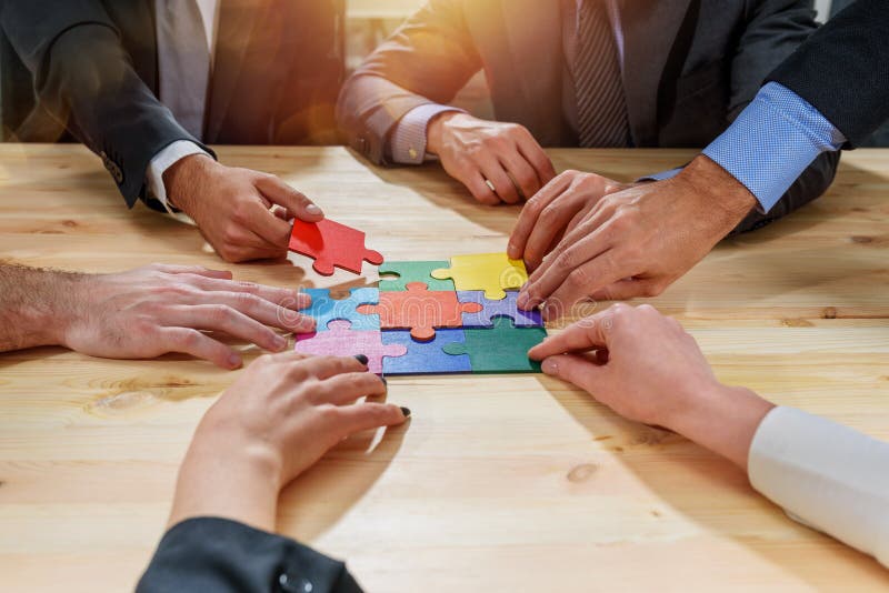 Teamwork of Partners Connect Puzzle Pieces As Integration and Startup ...