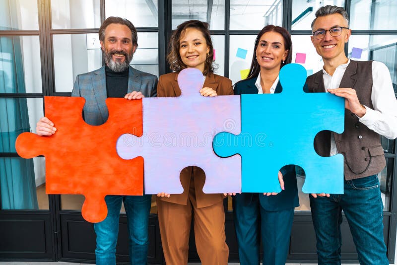Teamwork of Partners Connect Puzzle Pieces As Integration and Startup ...