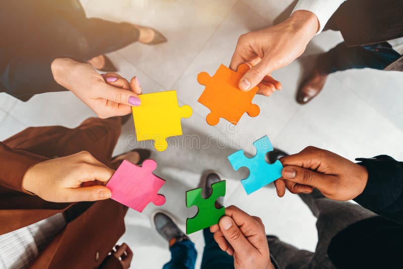 Teamwork of Partners Connect Puzzle Pieces As Integration and Startup ...
