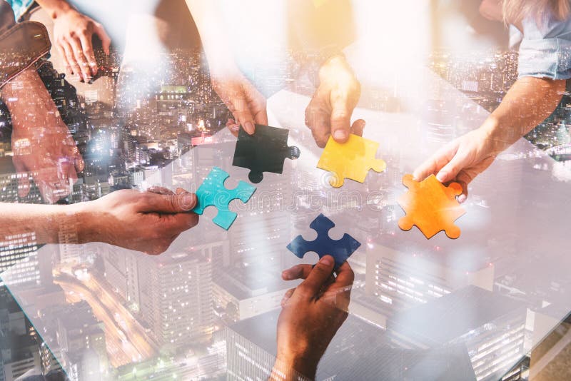 Teamwork of Partners Connect Puzzle Pieces As Integration and Startup ...