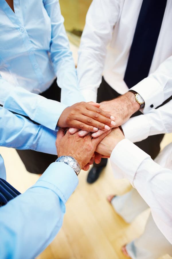 Teamwork is Powerful. Team of Executives with Hands on Top of One ...