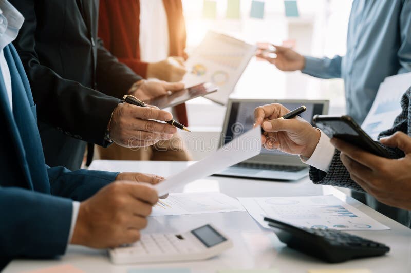 Teamwork Process, Business Team Using a Calculator To Calculate the ...