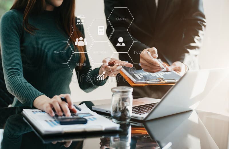 Teamwork Process, Business Team Using a Calculator To Calculate the ...