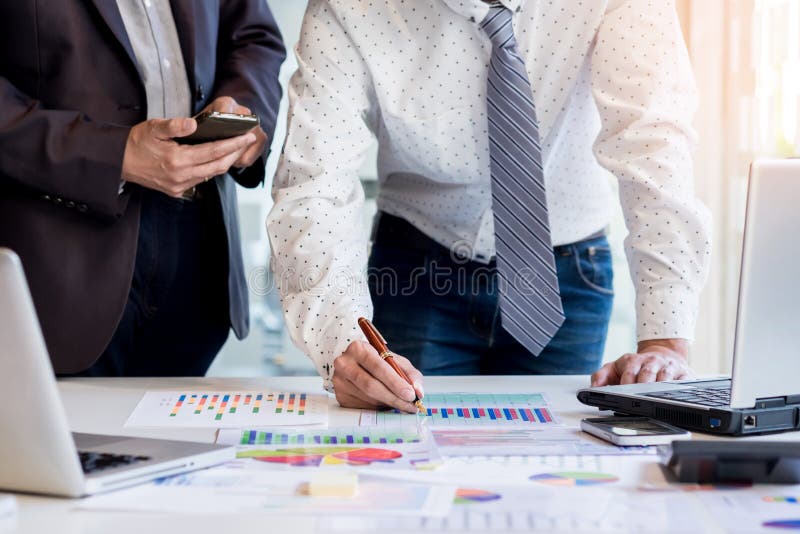 Teamwork Process. Young Business Managers Crew Working with New Stock ...