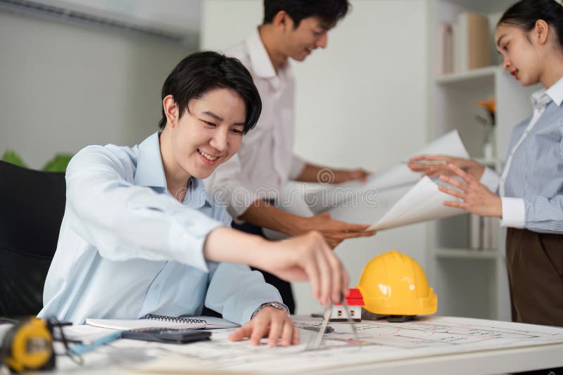 Teamwork and Project Design. a Group of Designers Collaborating Over ...