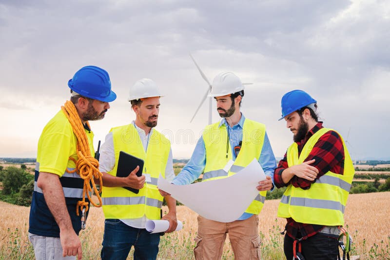 Teamwork of Renewable Energy Architect and Engineers Reading a ...