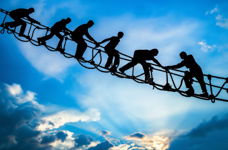 Teamwork on rope bridge stock photo. Image of adventure - 317628606