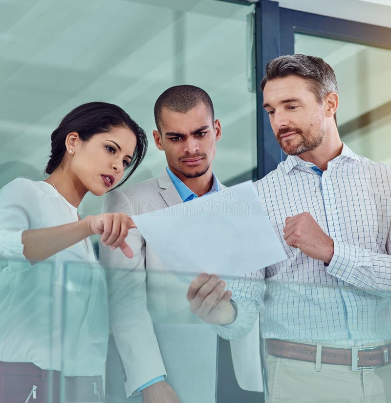 Teamwork is the Secret Formula. a Group of Coworkers Talking Over Some ...