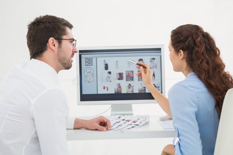 Teamwork Speaking and Working Together on Computer Stock Photo - Image ...