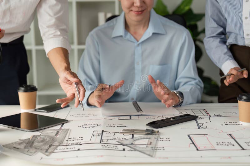 Teamwork and Strategy. Close-up of Professionals Engaged in Discussion ...