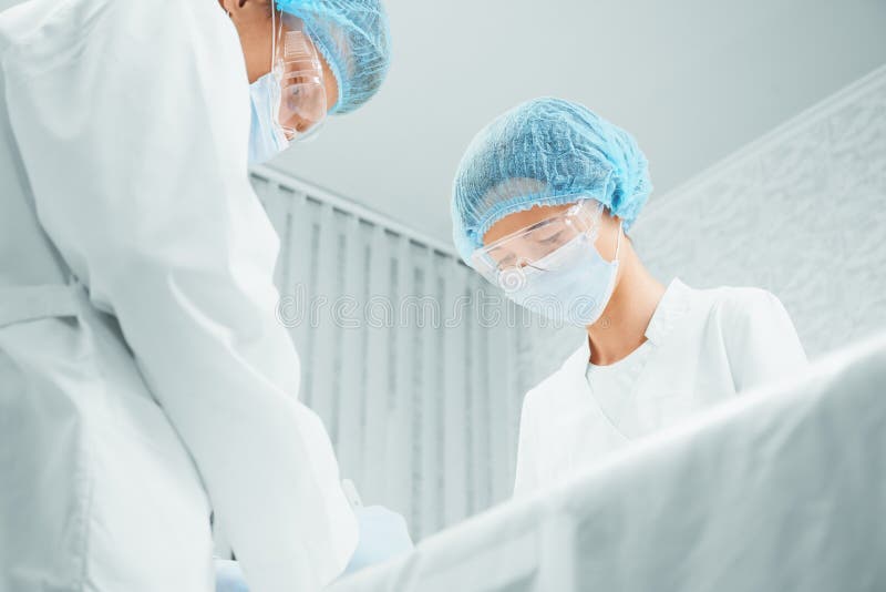 Teamwork surgeons stock image. Image of female, operating - 41761549