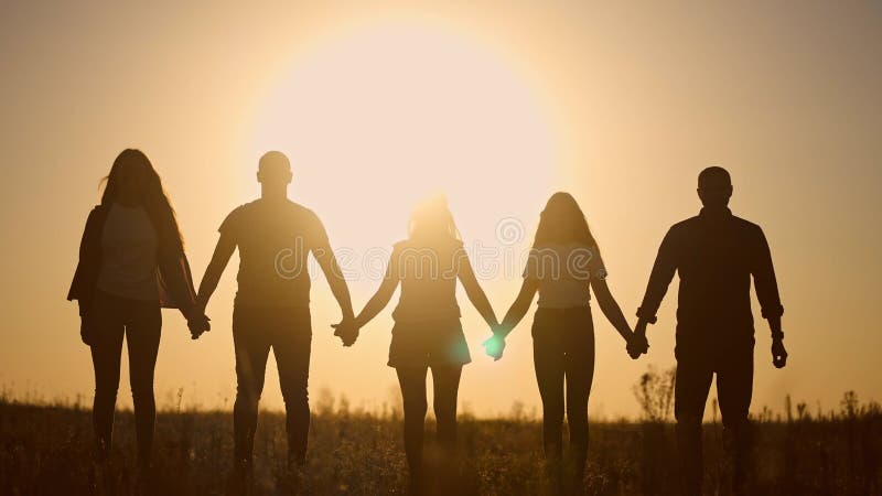 Teamwork. Team Community a Holding Hands Together Silhouette at Unity ...