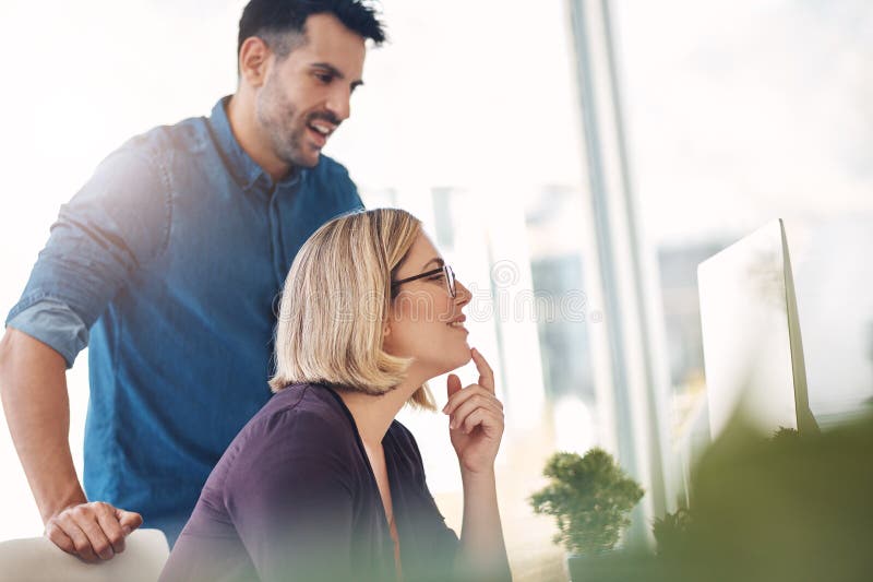 Teamwork and Tech Will Get the Job Done. Shot of a Young Man and Woman ...