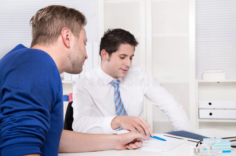 Teamwork: Two Business Men Sitting at Desk at Office. Stock Photo ...