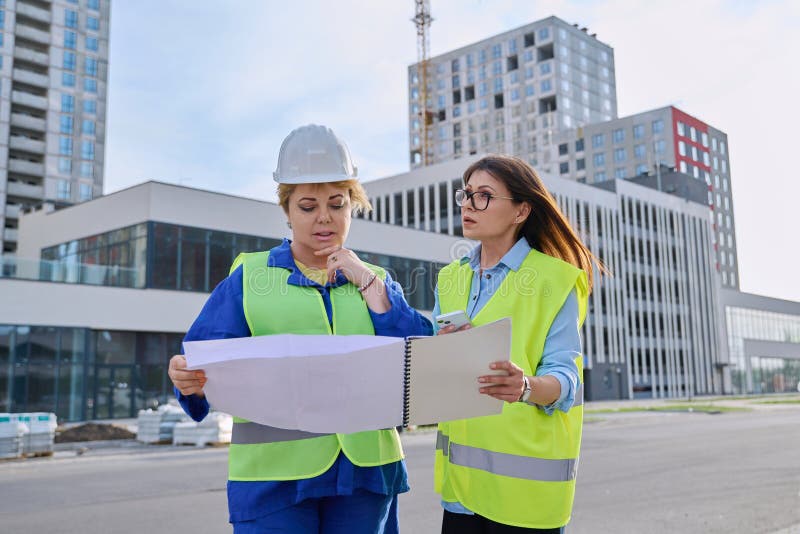 Two Confident Women Talking Working on Construction of Residential ...