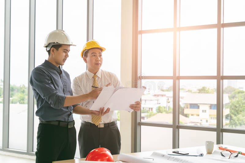 Teamwork, Two Engineers Working and Explaining in the Office Stock ...