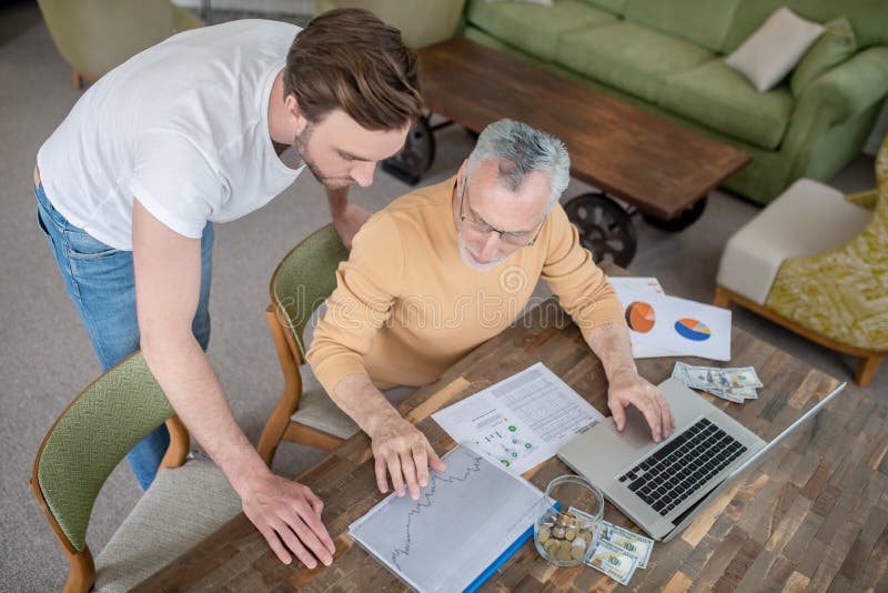 Two Men Working Together on a Project and Looking Involved Stock Image ...