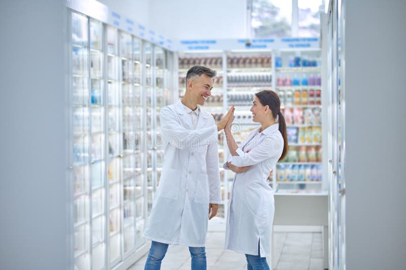 Two People in Lab Coats Feeling Good and Smiling Stock Image - Image of ...