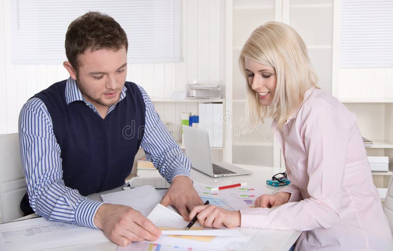 Teamwork between Two Work Colleagues at Desk at Office. Stock Image ...
