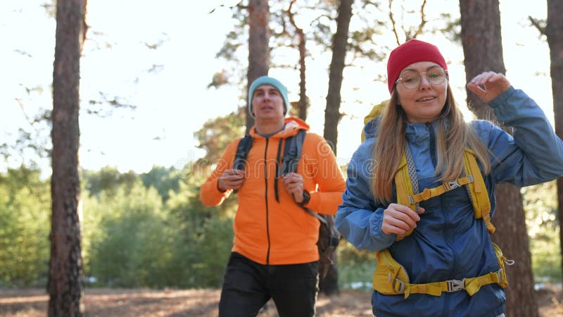 Teamwork. a Unity Group of Hikers Tourists Walk through the Forest with ...