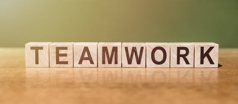 TEAMWORK Word Written on Wooden Blocks on Wooden Table. Concept for ...
