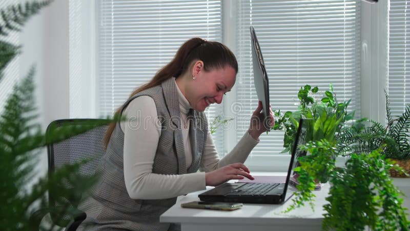 Teamwork at Work, Young Woman Having Fun Hiding Behind a Folder of ...