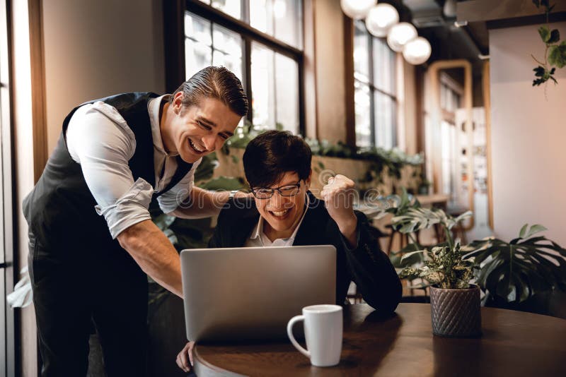 Teamwork or Working Together Concept. Two Businessman Working on Laptop ...