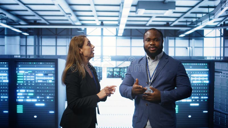 Teamworking Colleagues Looking at Holograms in Data Center, Working ...