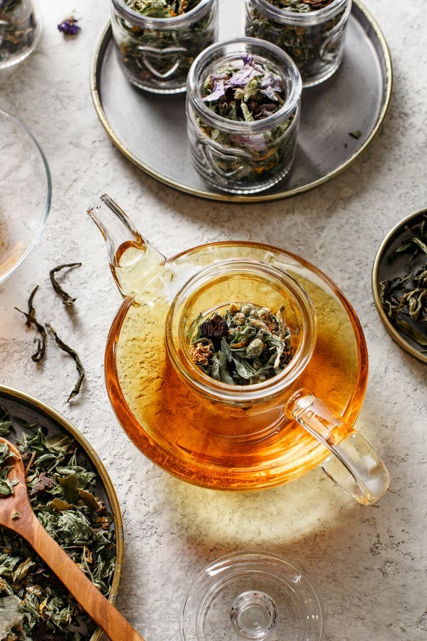 Teapot with fresh tea stock photo. Image of floral, green - 130375984