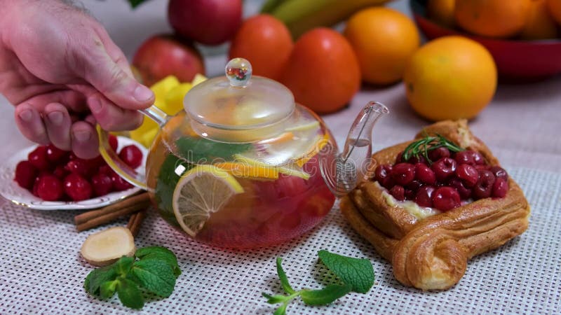 Teapot with Fruit Tea and Ingredients for Cooking on the Table Stock ...