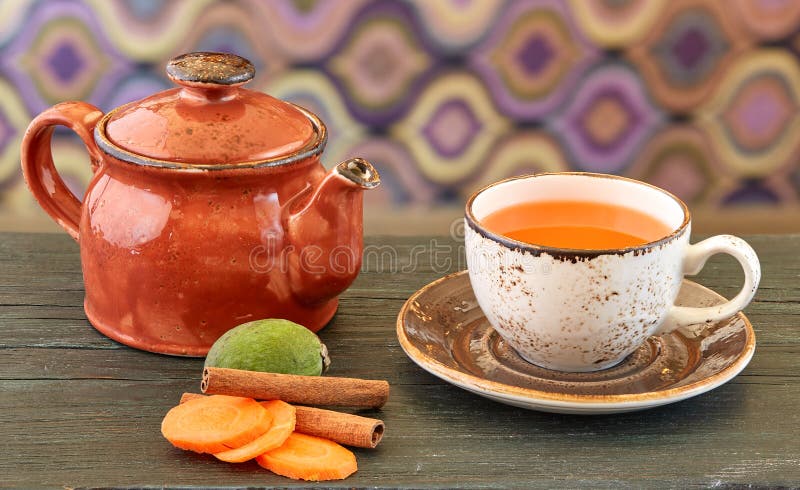 Teapot with organic tea stock image. Image of isolated - 142675539