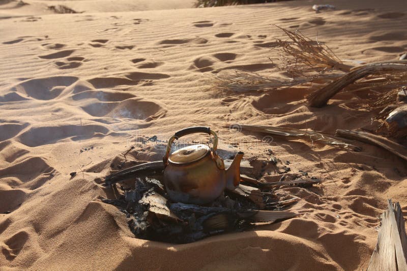 A Teapot Over the Coals in the Desert Stock Photo - Image of yellow ...