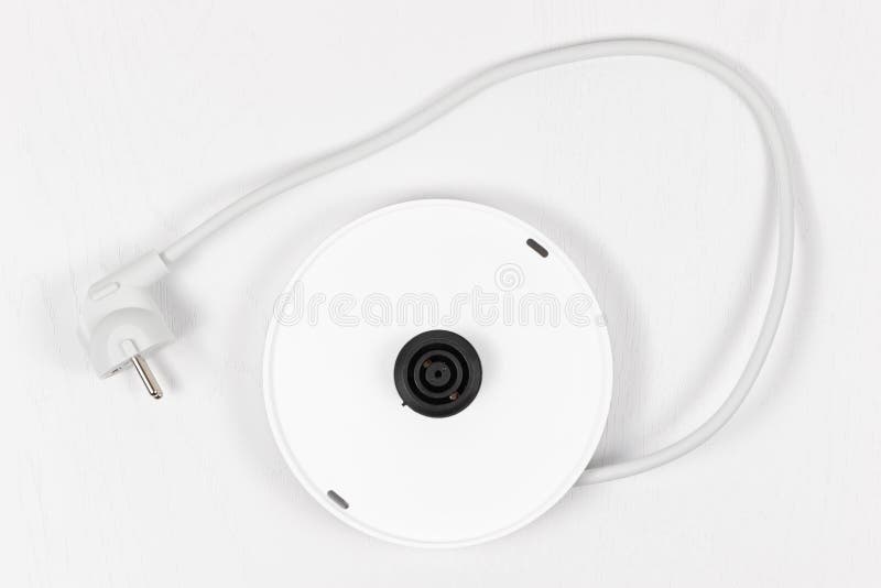 Teapot Stand with Wire and Electric Plug on White Wooden Table Stock ...