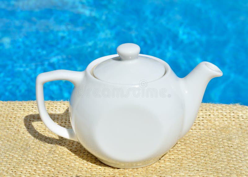 Teapot on a Swimmimg Pool Background. Stock Photo - Image of dishware ...