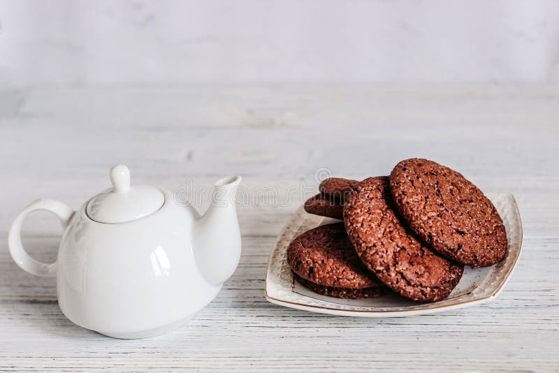 Teapot with Tea and Chocolate Biscuits, Spring Still Life. Stock Photo ...