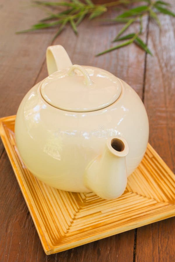 Teapot on the wooden table stock image. Image of table - 38681029