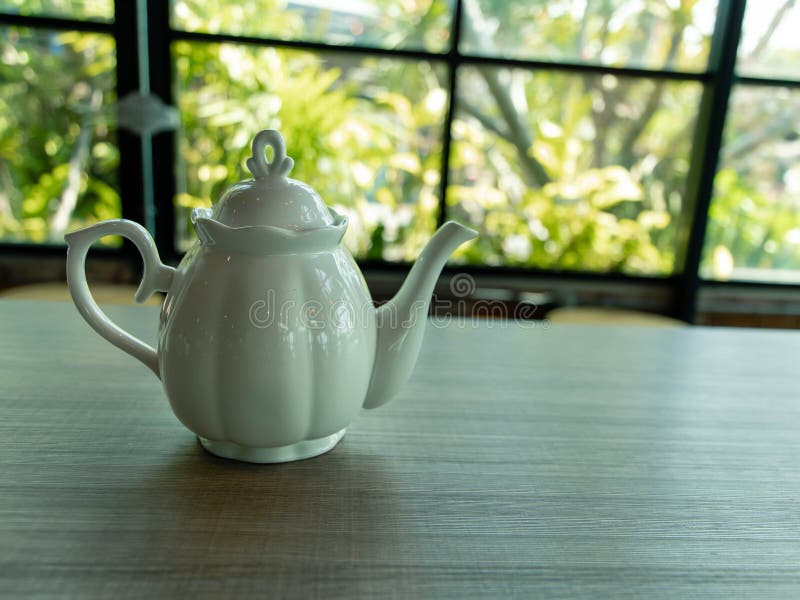 Tea Pots on a Wooden Table in a Coffee Shop Stock Image - Image of ...
