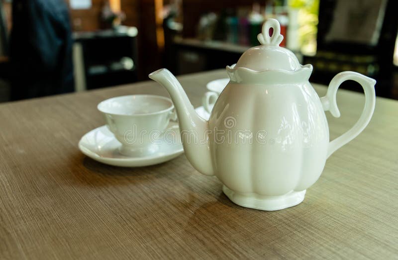 Tea Pot on a Wooden Table in a Coffee Shop Stock Image - Image of ...