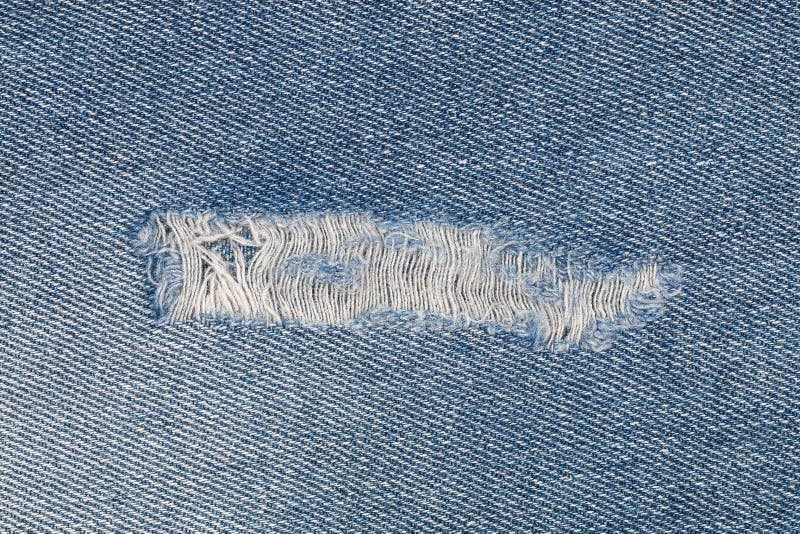Tear on Blue Jeans for Pattern and Background Stock Image - Image of ...