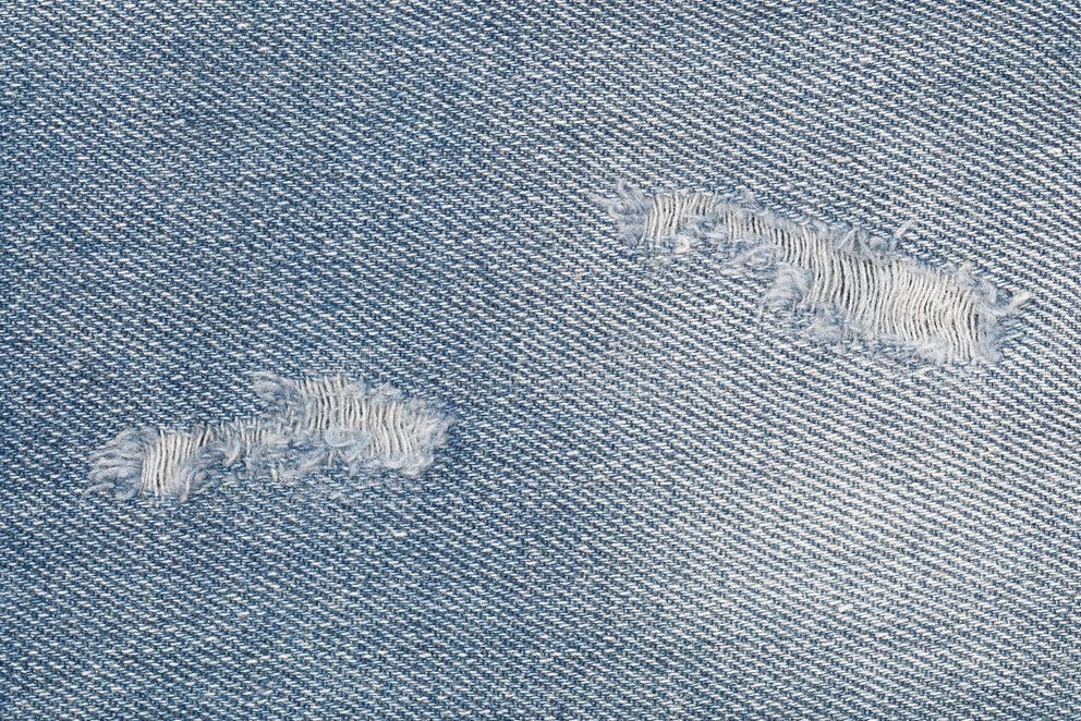 Tear on Blue Jeans for Pattern and Background Stock Image - Image of ...