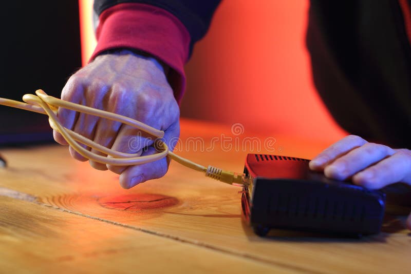 Tearing with Force the Internet Cable from the Adsl Modem by a Person ...