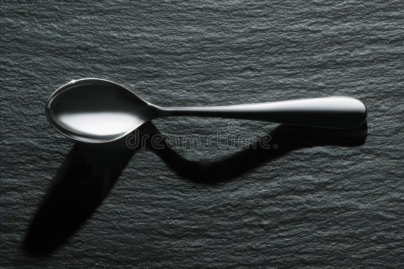 Teaspoon on black slate stock photo. Image of spoon, clean - 21164008