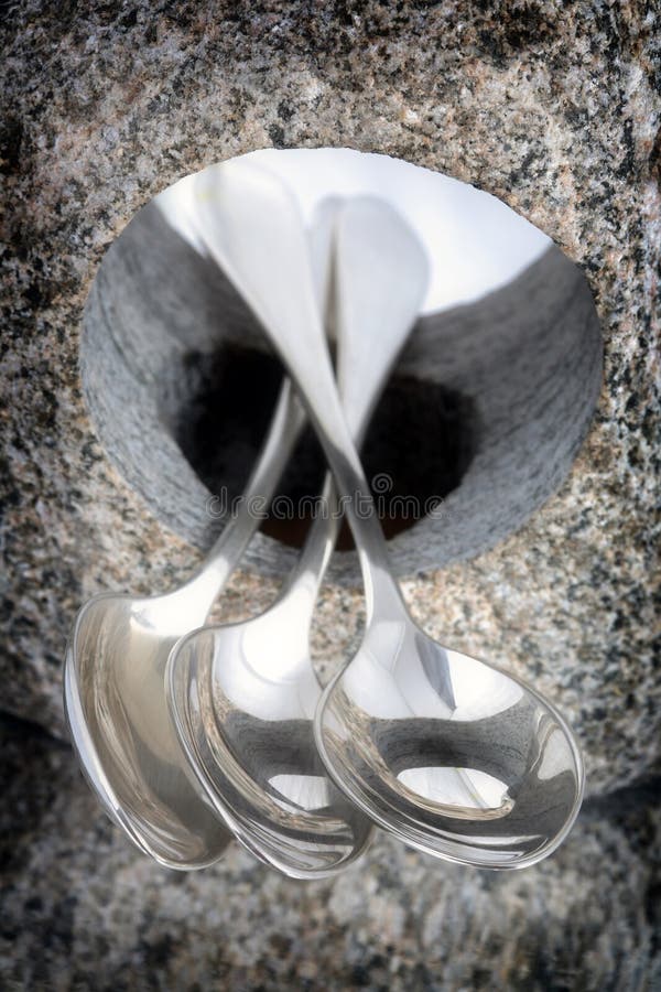 Teaspoons Balancing on Stone Stock Photo - Image of cutlery, silver ...