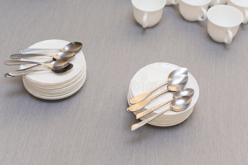 Teaspoons on Saucers and Empty White Cups on the Table Stock Photo ...